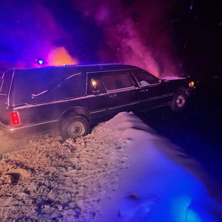 Hearse carrying a body comes to a rest ‘teetering’ over a 100-foot ...